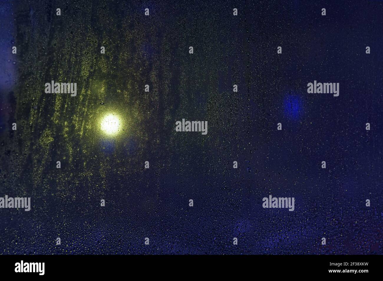 Water drops reflections on the window in night Stock Photo - Alamy