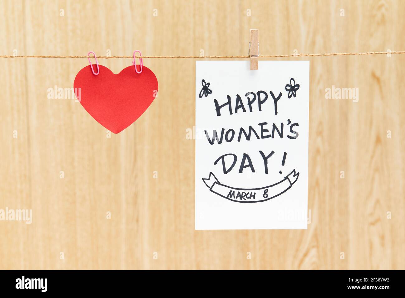 A "Happy Women's Day" message on March 8 with a heart-shaped paper ...