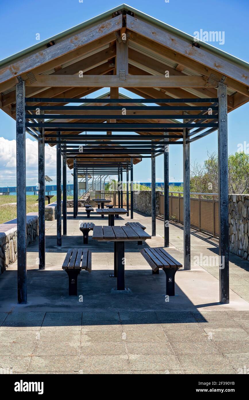Tables and seating under shade structures at a lookout Stock Photo - Alamy