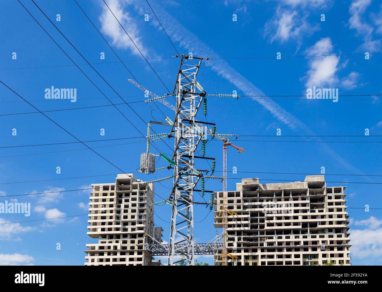 Electricity pylons and construction site, Industrial image. Moscow ...
