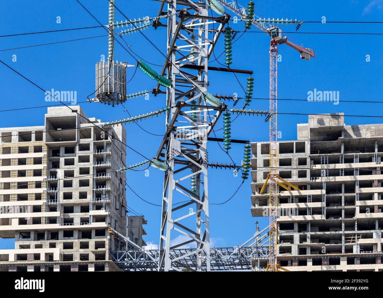 Electricity pylons and construction site, Industrial image. Moscow ...