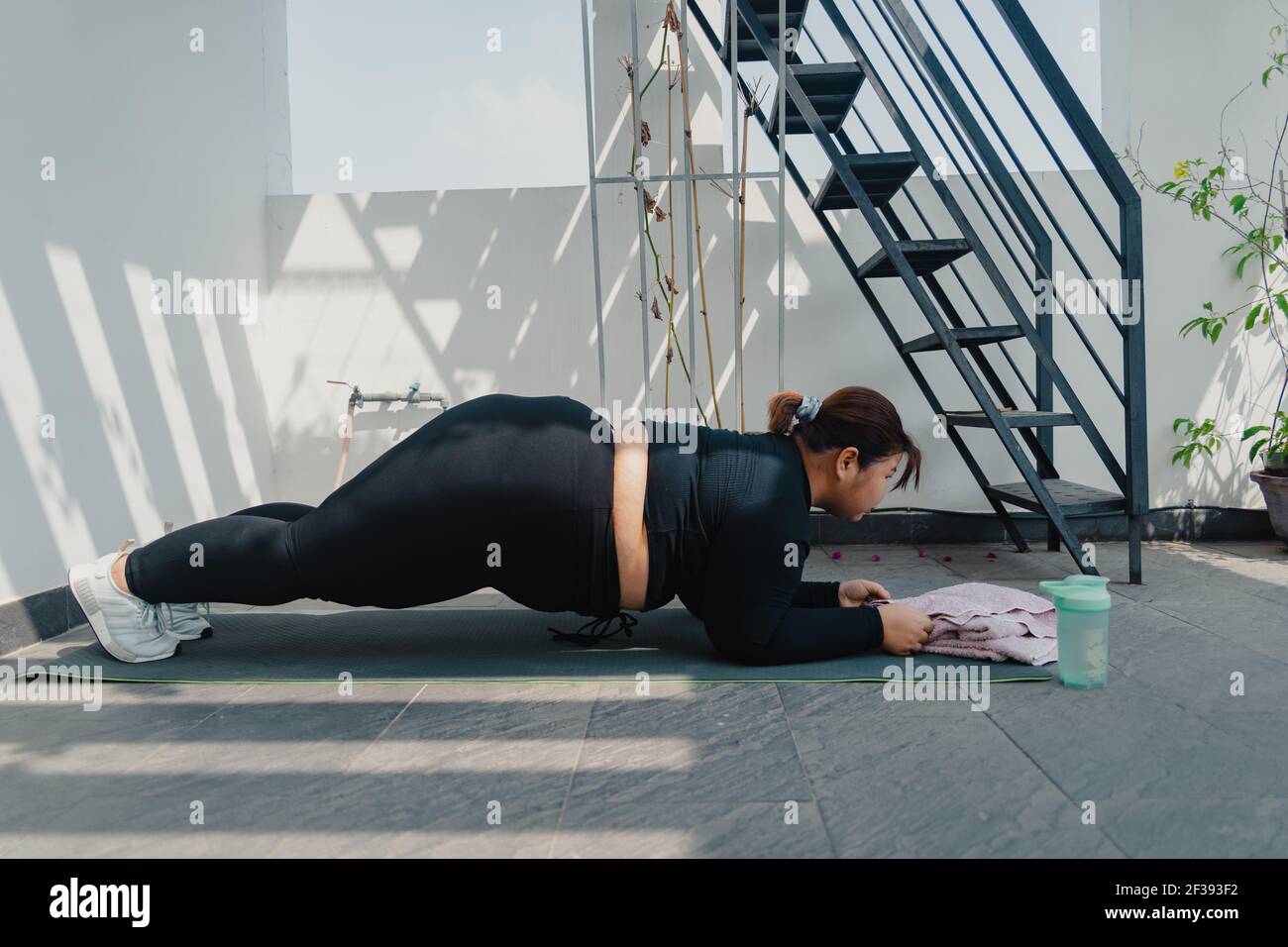 Health, fitness and sports concept. Plus size young asian woman doing ...