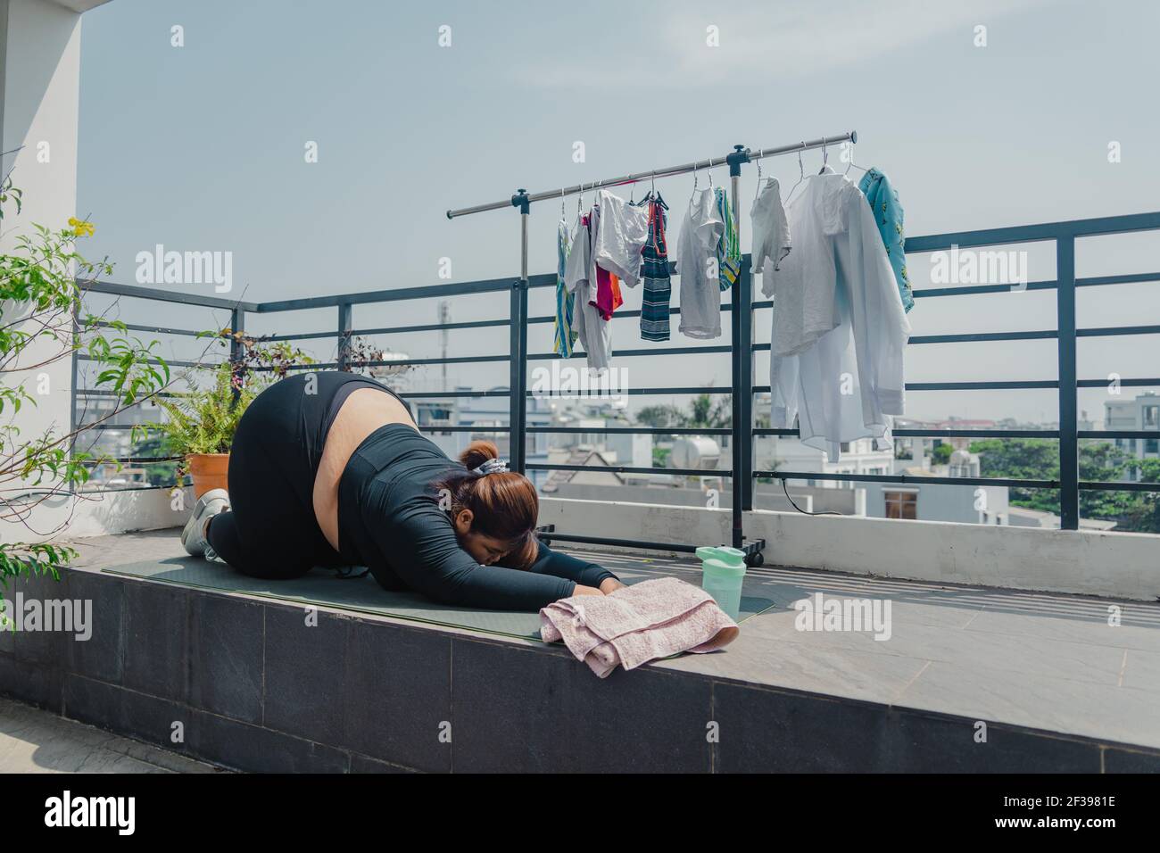 Health, fitness and sports concept. Plus size young asian woman doing ...