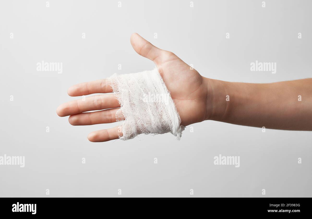 hand injury bandage health problems gray background Stock Photo - Alamy
