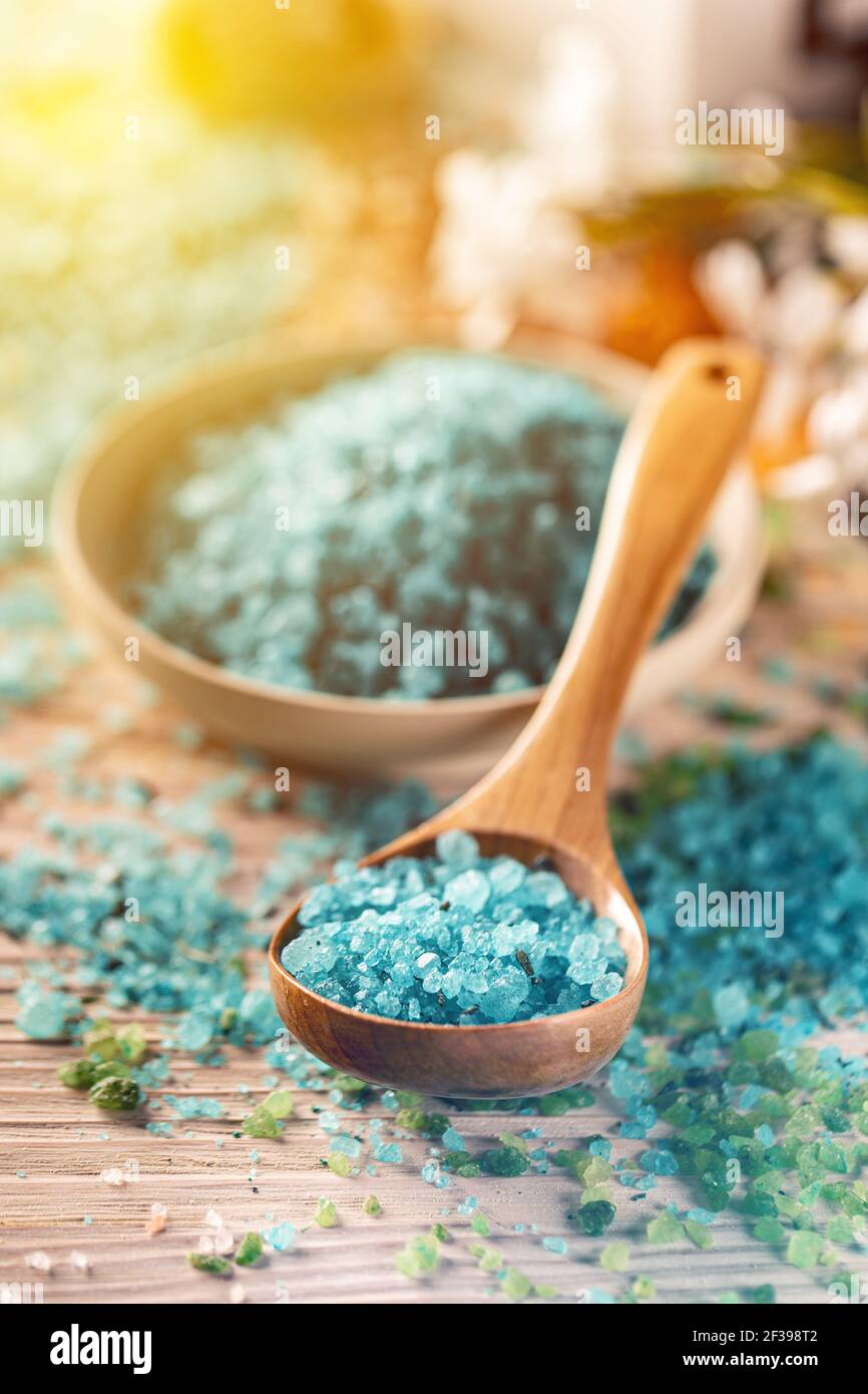 Wooden spoon with blue aromatic sea salt for bathroom procedures Stock ...
