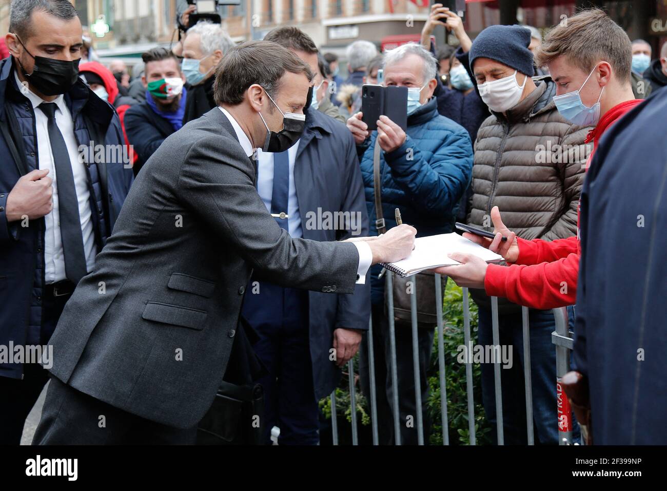 French President Emmanuel Macron go on a walkabout along with Spanish ...