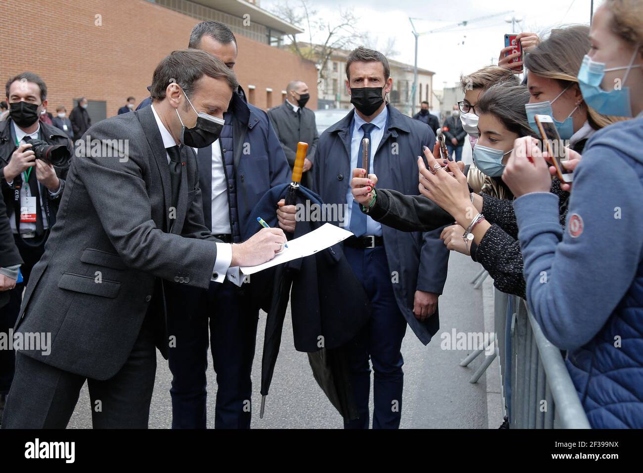 French President Emmanuel Macron go on a walkabout along with Spanish ...