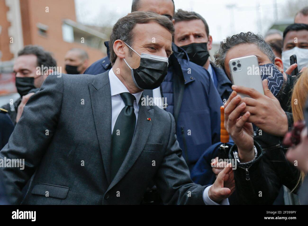 French President Emmanuel Macron go on a walkabout along with Spanish ...