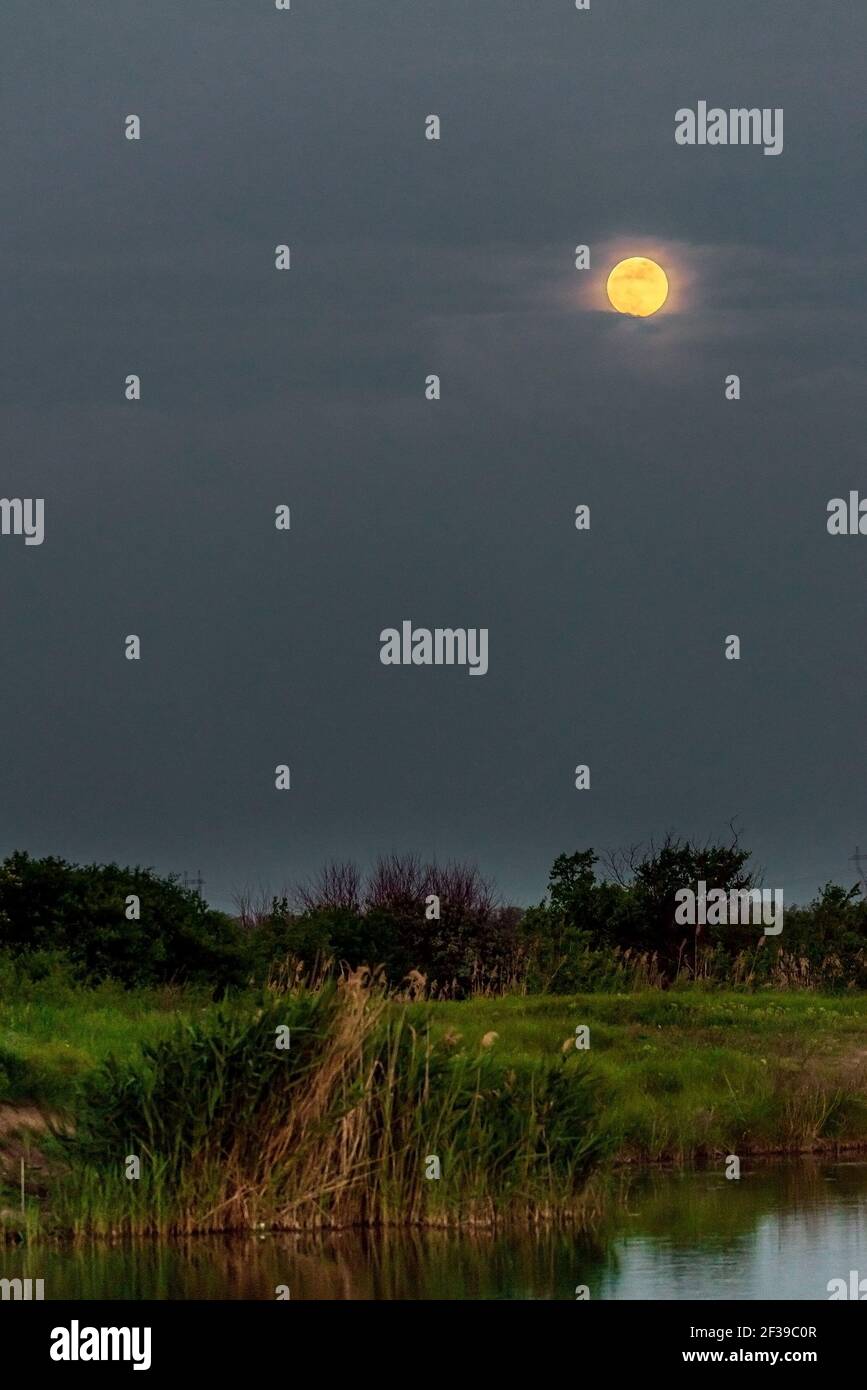 night landscape with moon and moonbeam in river Stock Photo - Alamy