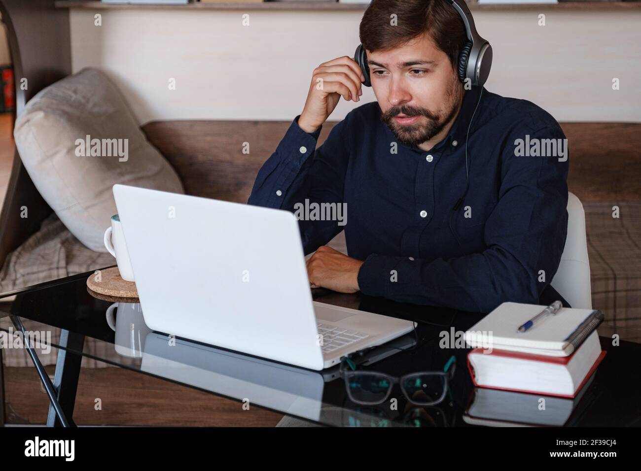 Happy male student online teacher wear headphone talk video calling ...