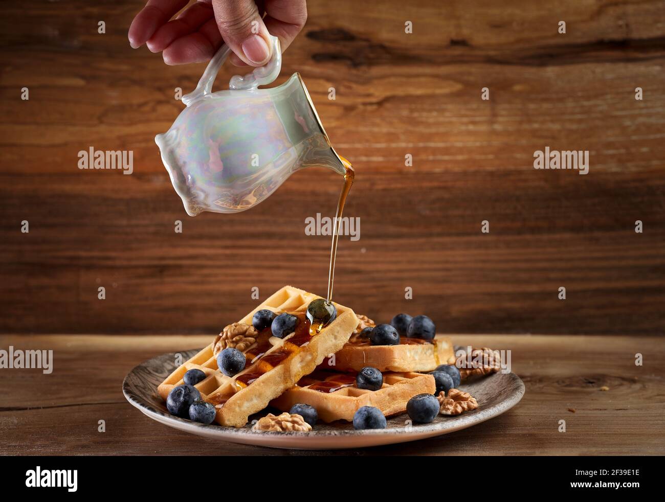 Pouring maple syrup on belgian hi-res stock photography and images - Alamy
