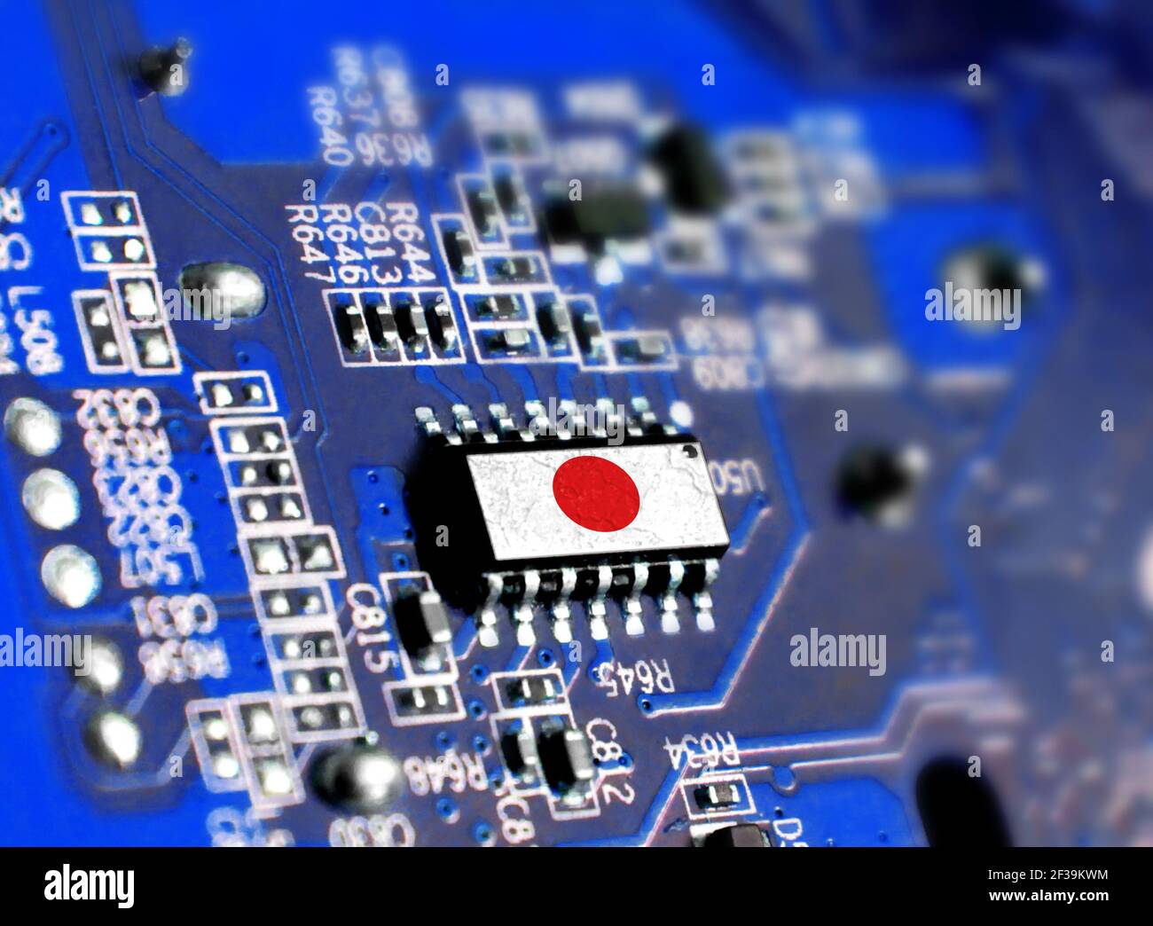 Electronic board with embedded microchip and shown flag of Japan. The ...