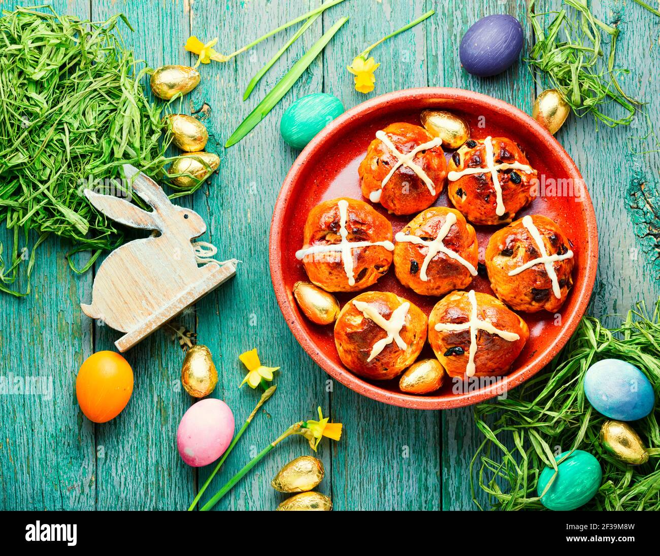 Easter hot cross buns and holiday decor.Traditional English Easter buns ...