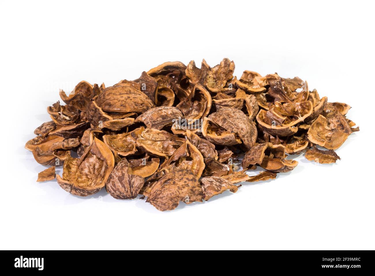 Pile of cracked Walnut shells isolated on white background Stock Photo ...