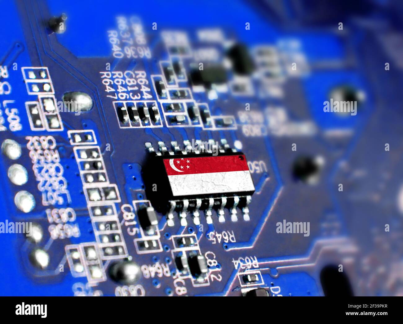 Electronic board with embedded microchip and shown flag of Singapore ...