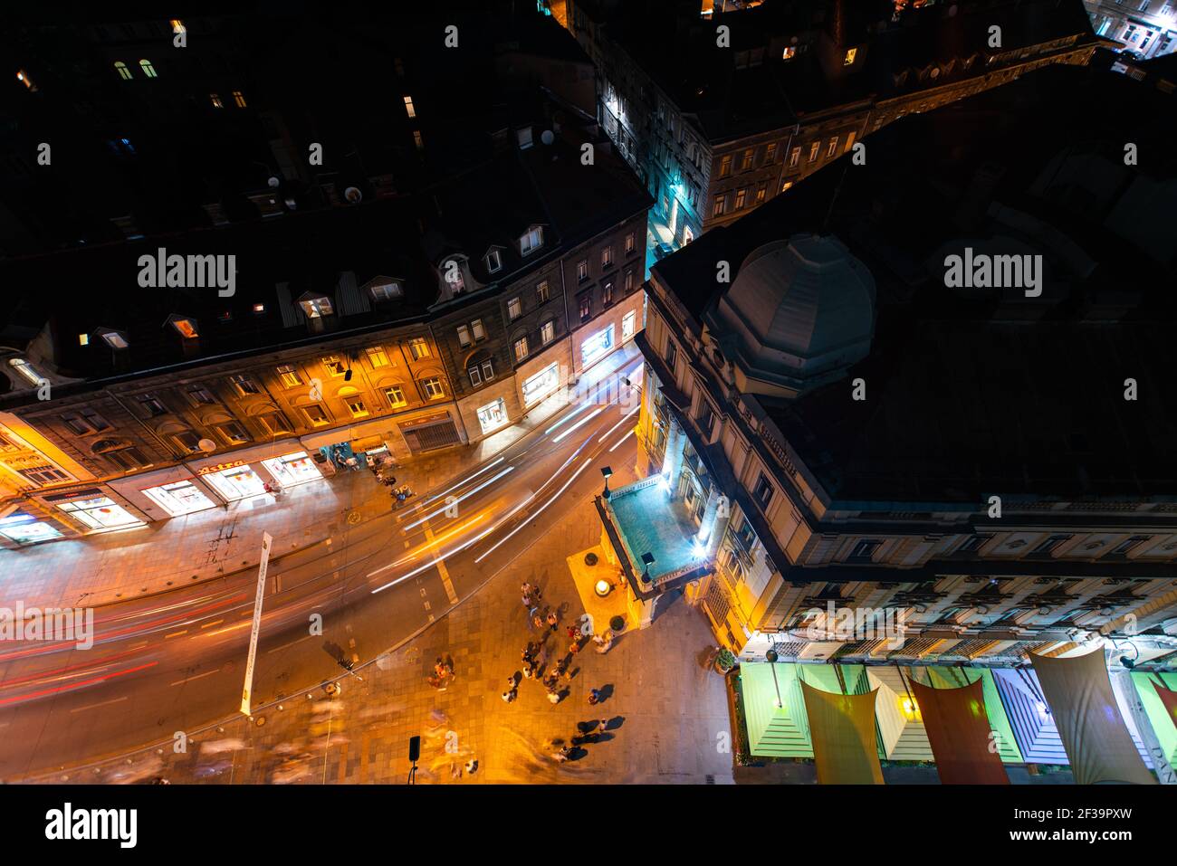 Overhead view of pedestrians and traffic on street at night Stock Photo ...