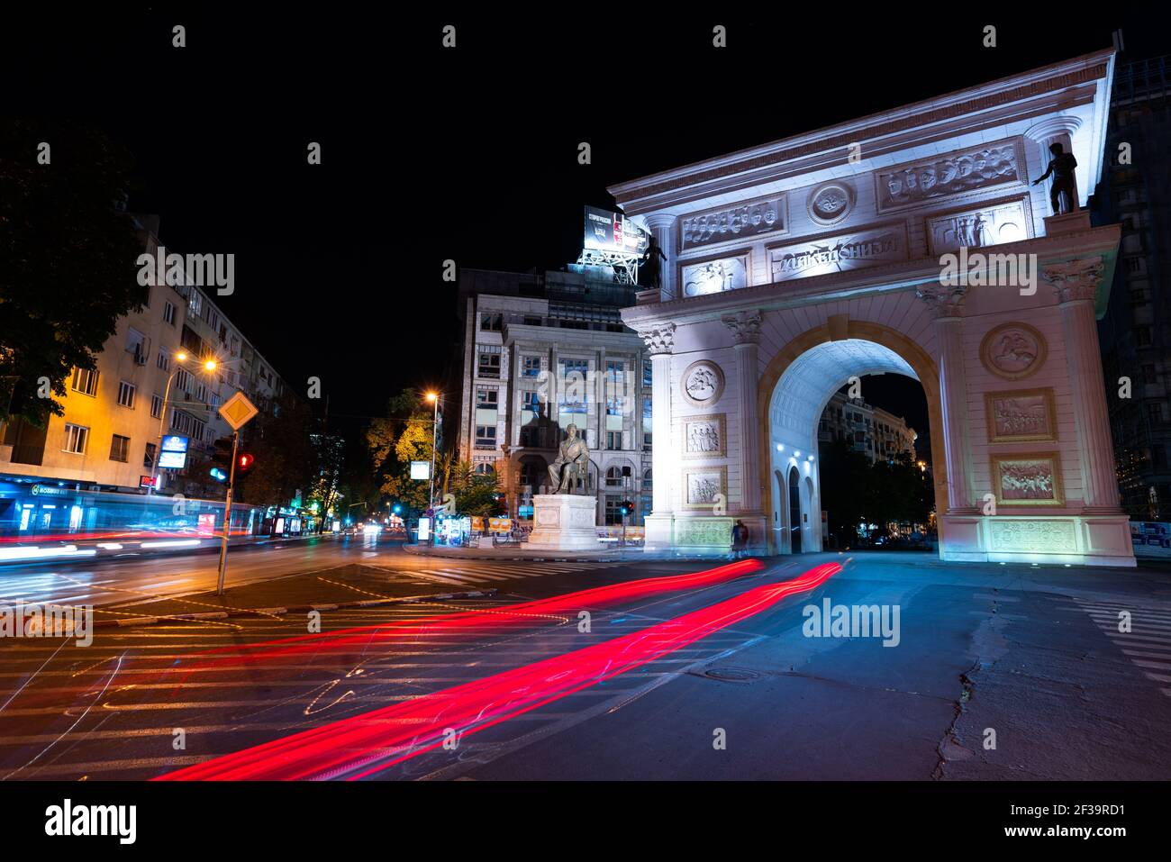 Macedonia Gate with light trail of traffic driving on street in ...
