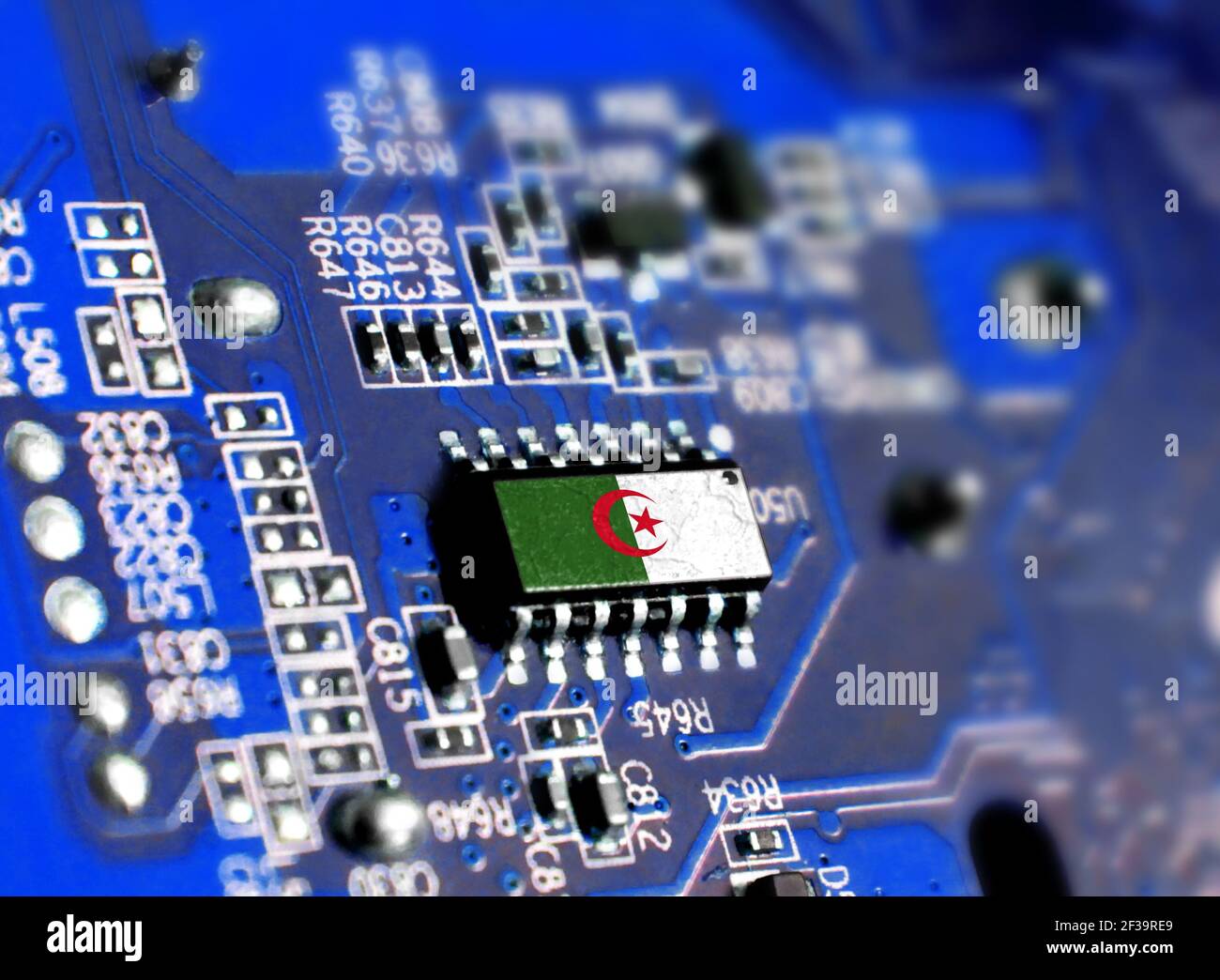 Electronic board with embedded microchip and shown flag of Algeria. The ...