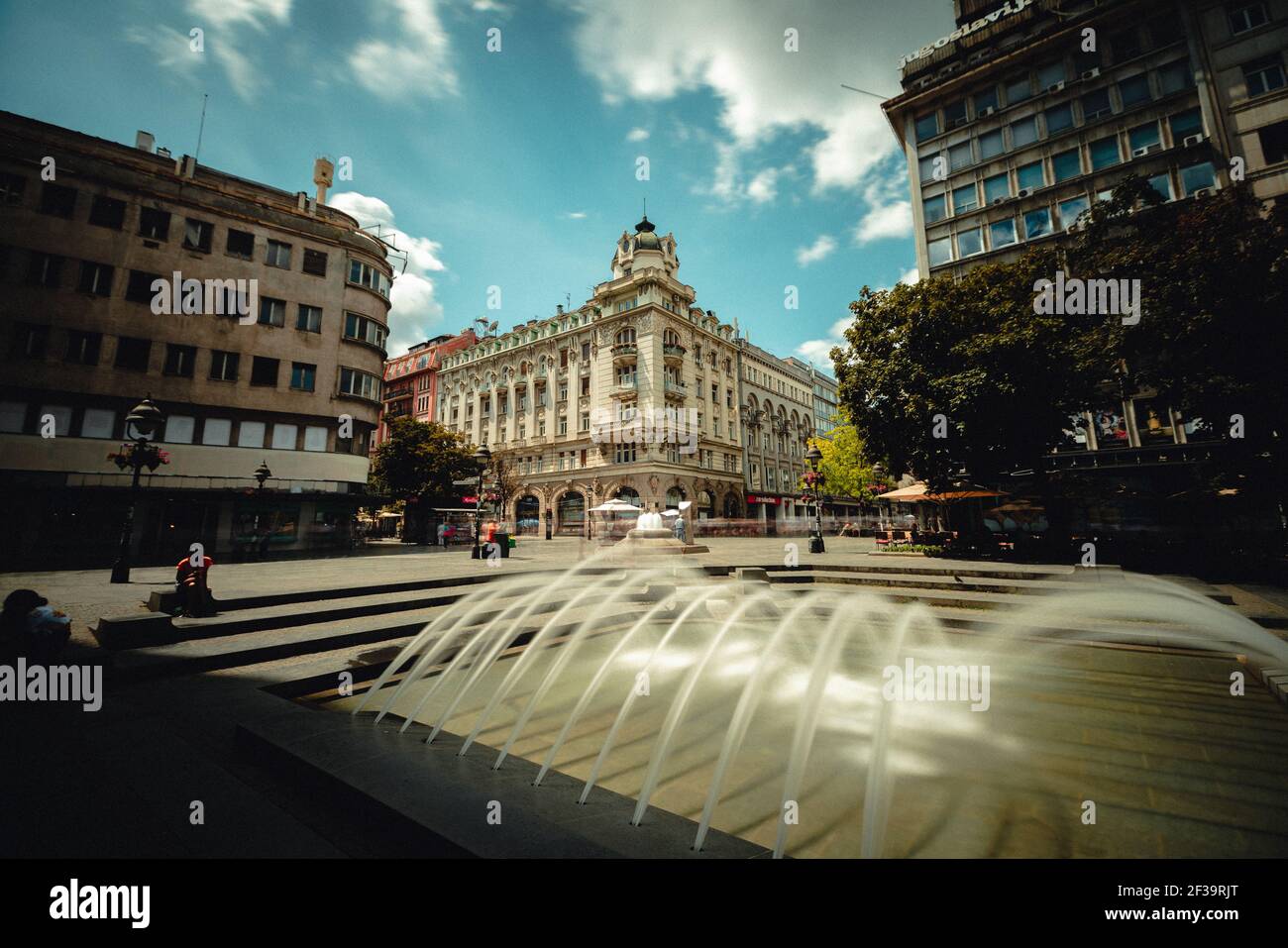 Low angle view of historic buildings and fountain in Belgrade city ...