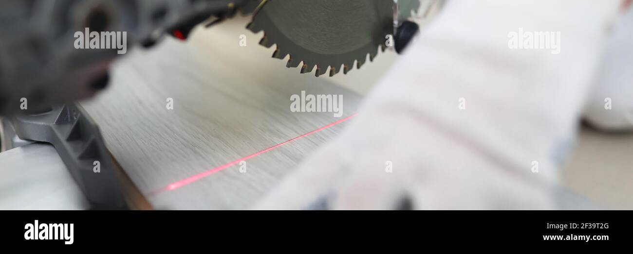 Electric saw for trimming laminate Stock Photo - Alamy