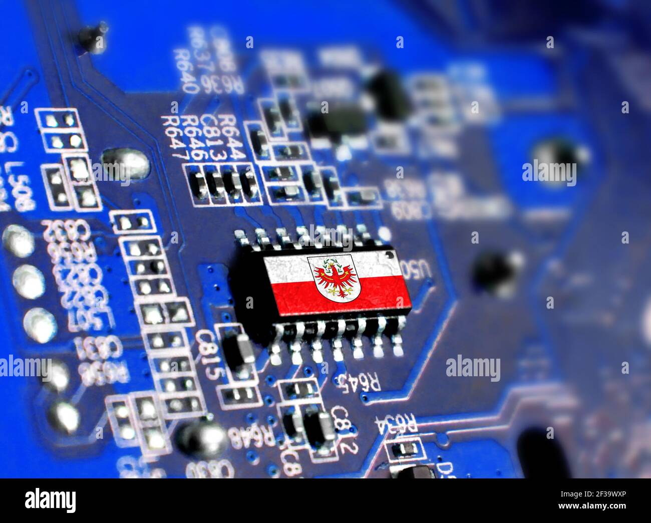 Electronic board with embedded microchip and shown flag of Tyrol. The ...