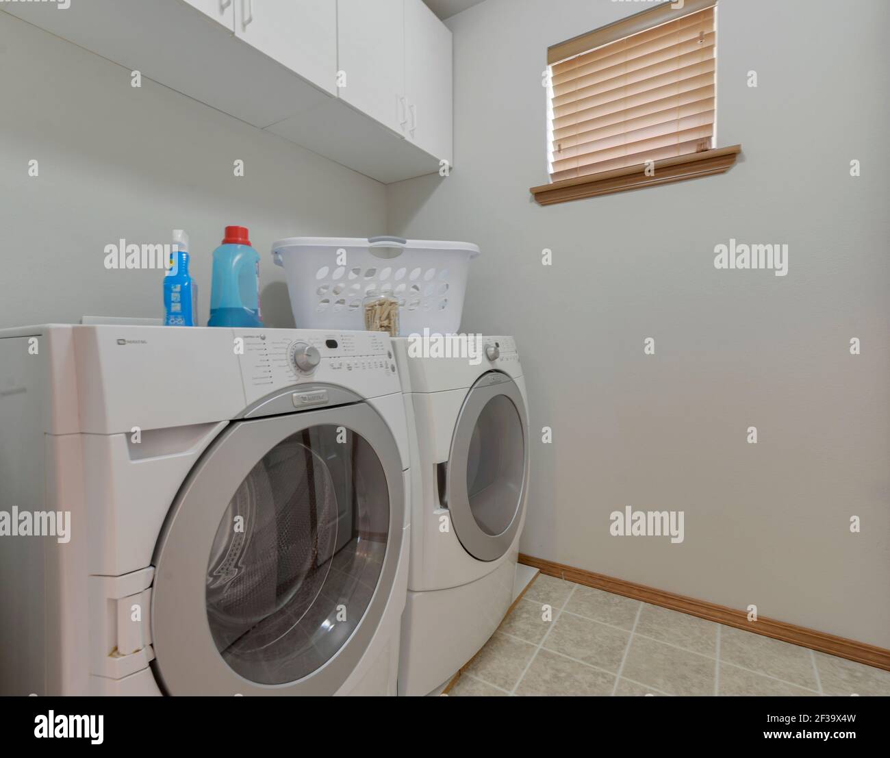 Modern residential laundry room interior Stock Photo - Alamy