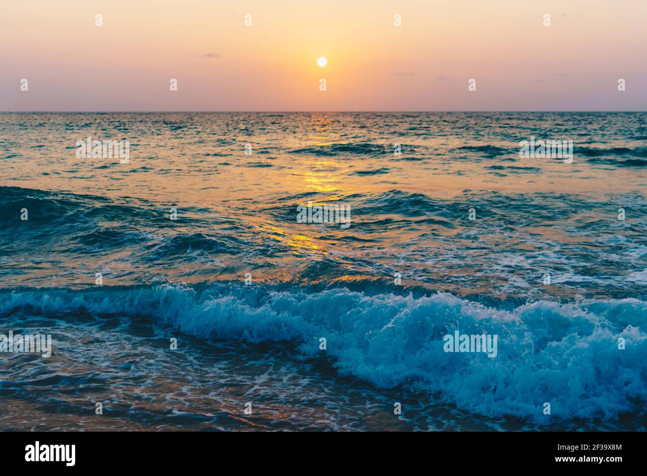 Colorful vibrant ocean sea wave beach summer with sunrise or sunset ...