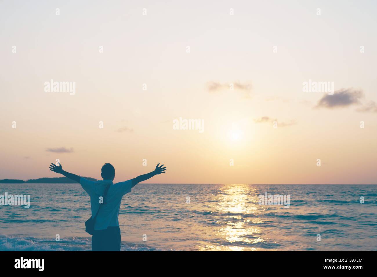 Man rise hands up to sky travel around the world with summer beach ...