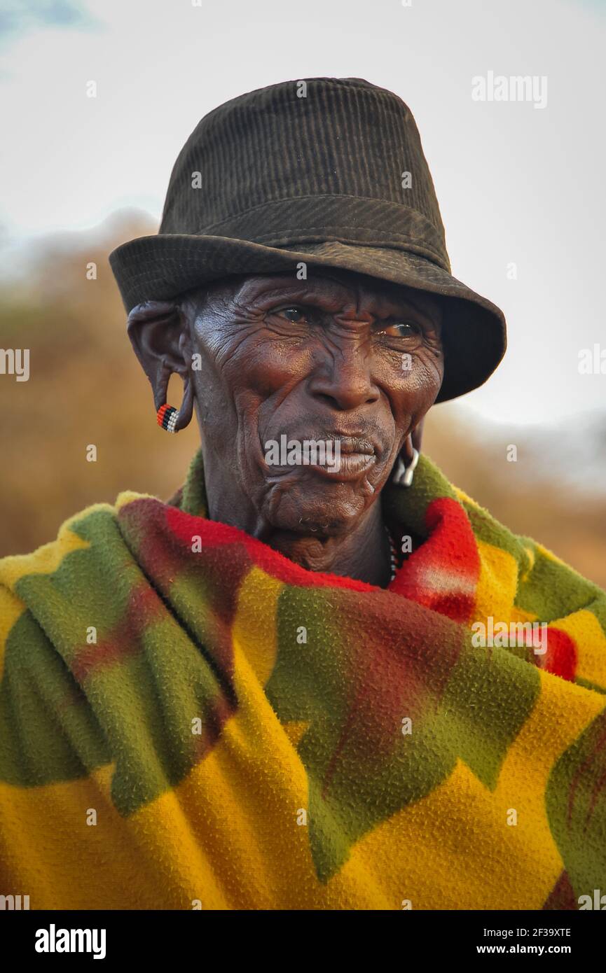 Portrait of Samburu tribal elder wearing colourful blanket and western ...