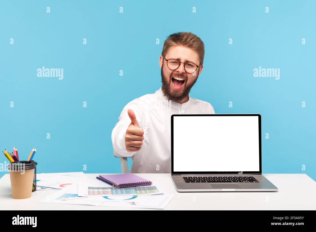 Extremely happy satisfied man office manager showing thumbs up sitting ...