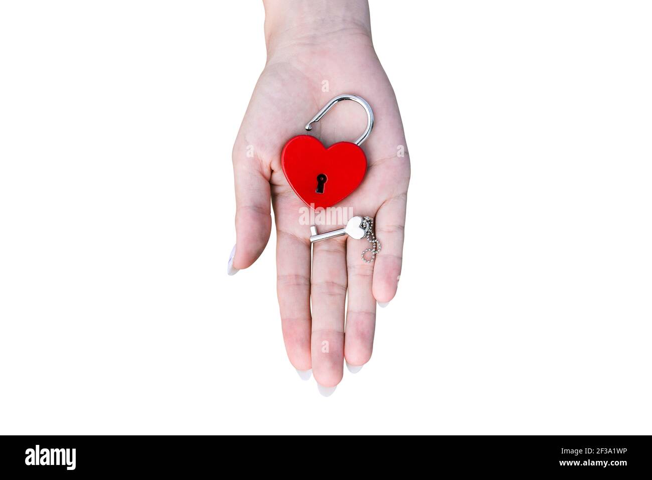 Love lock and key in the shape of a heart on a female palm isolated on ...