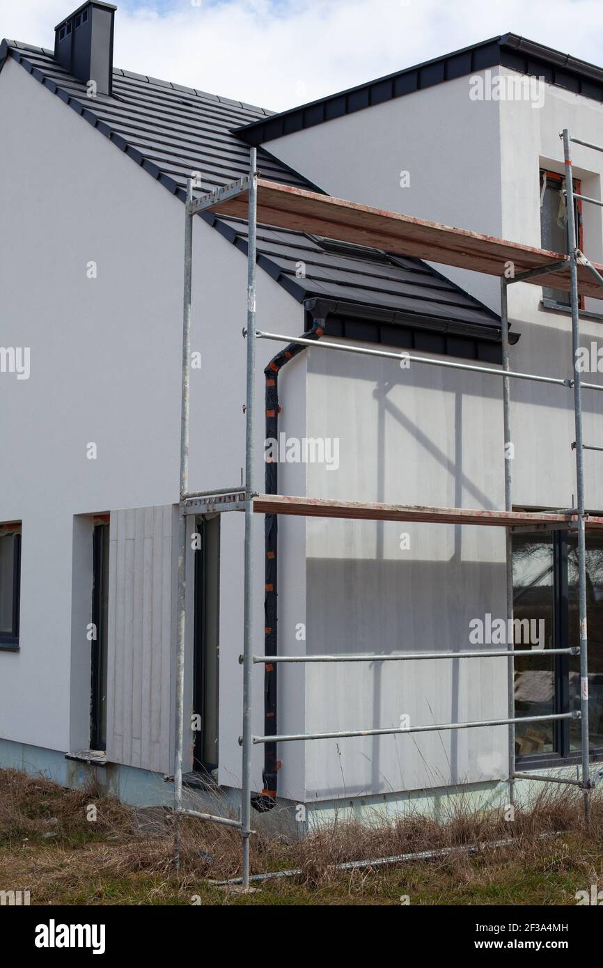 Construction site of a small family house - scaffolding Stock Photo - Alamy