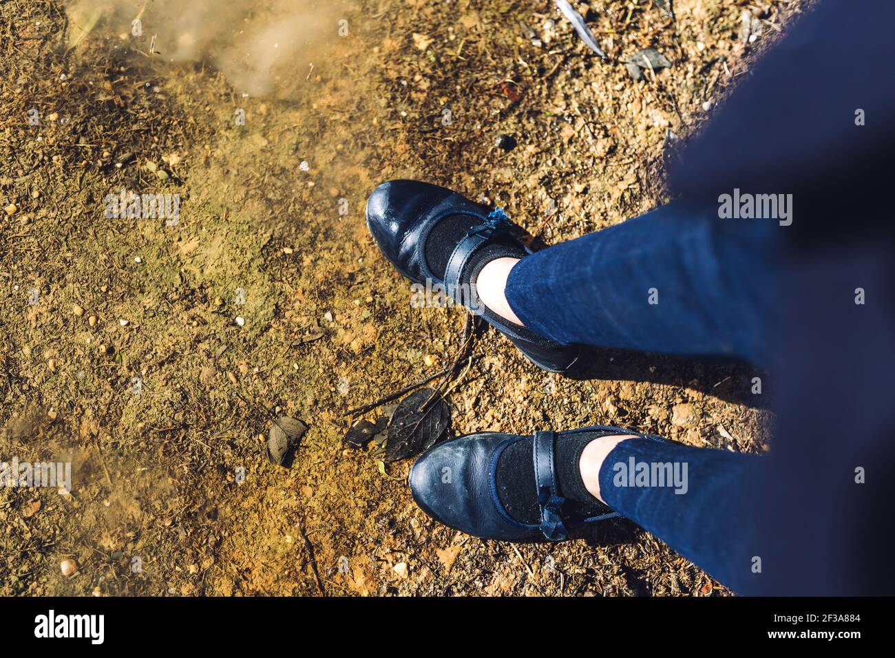 A high angle shot of young girl legs on the ground Stock Photo - Alamy