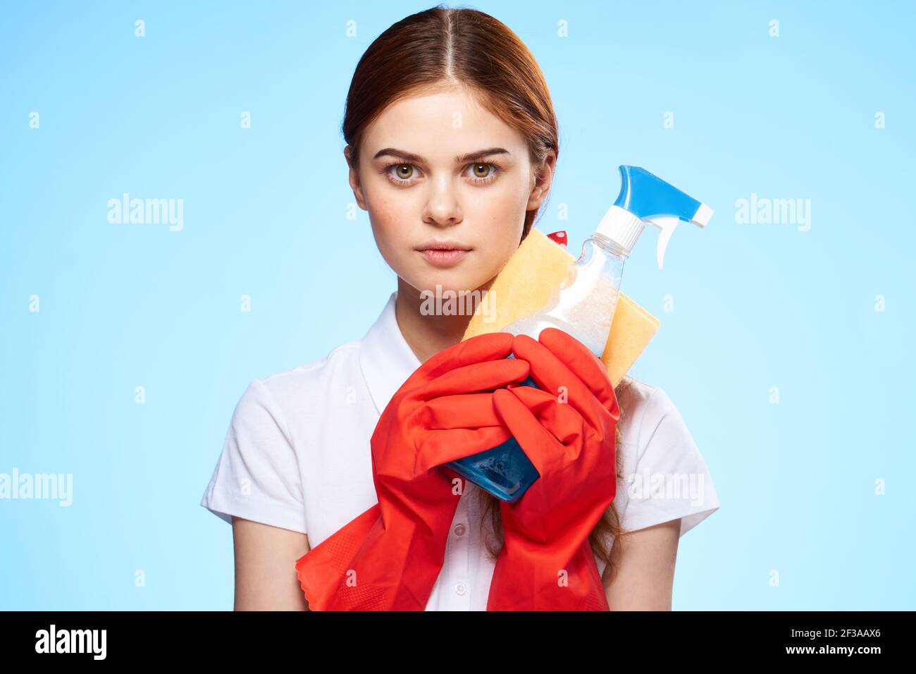 cleaning lady with washing utensils in hands housework professional ...