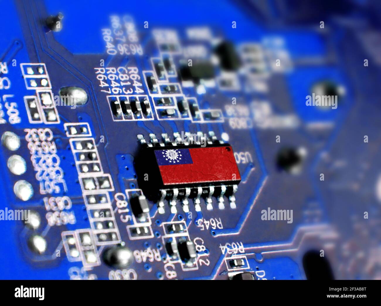 Electronic board with embedded microchip and shown flag of Myanmar ...
