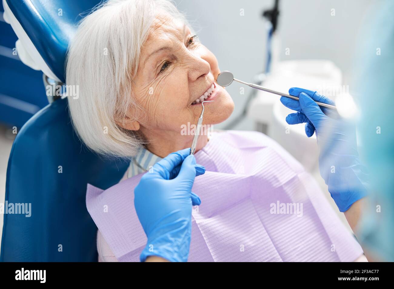 Inspecting teeth hi-res stock photography and images - Alamy