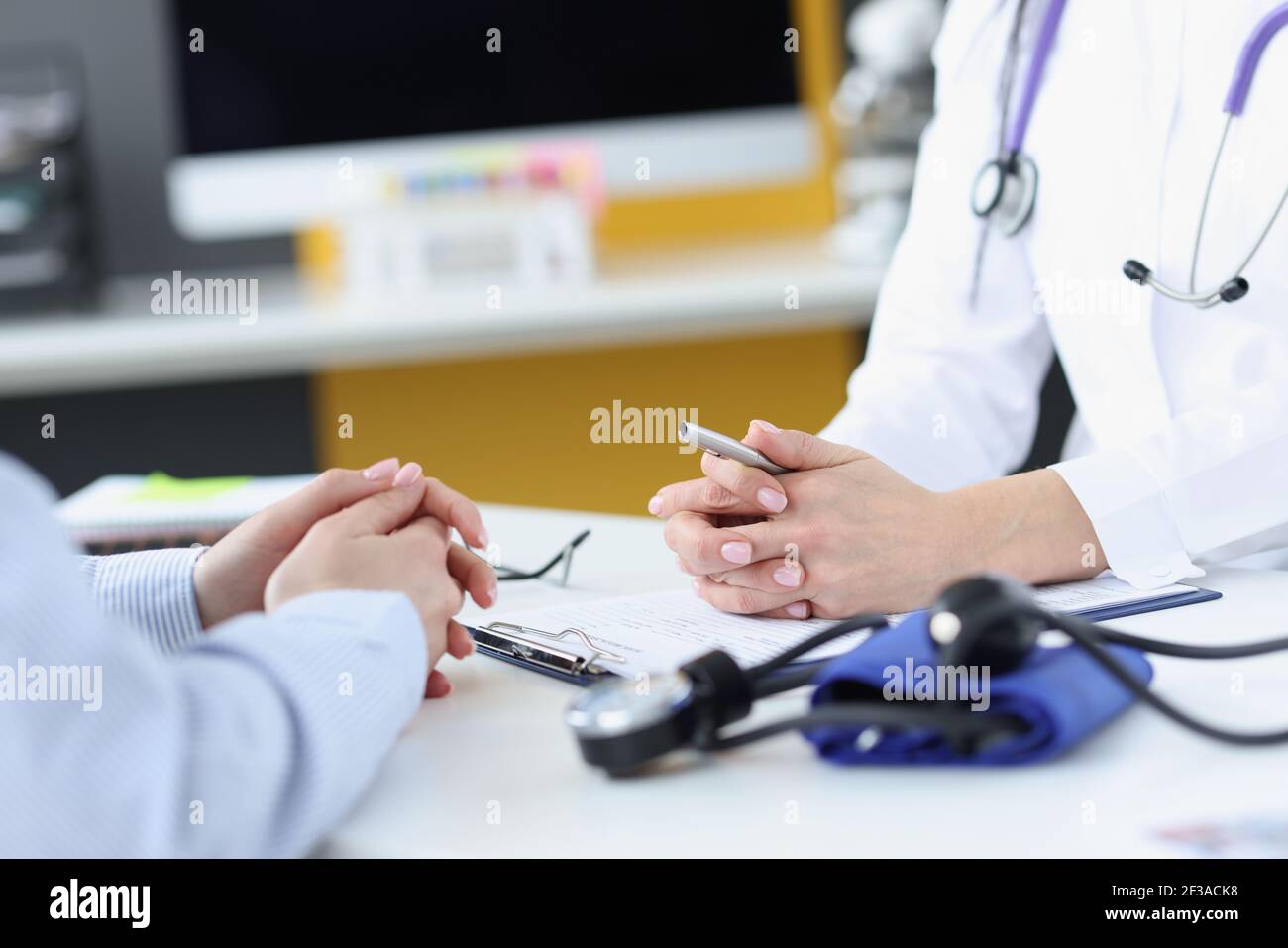 Doctor communicating with patient in clinic closeup Stock Photo - Alamy