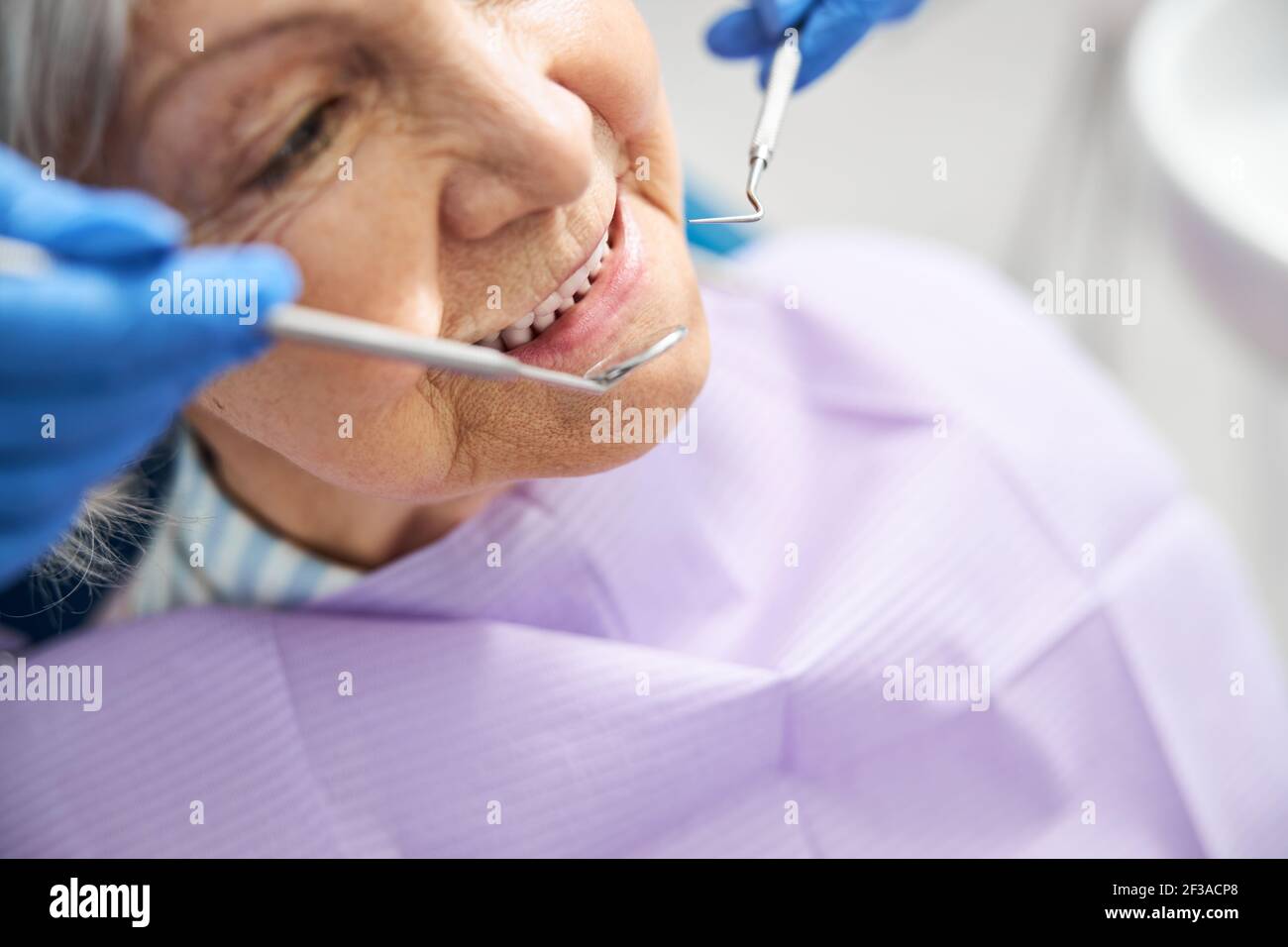 Assessment of old person teeth with dental devices Stock Photo - Alamy