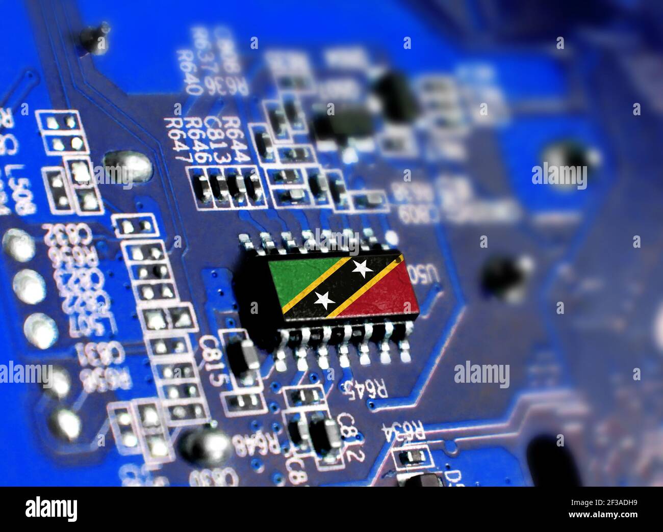 Electronic board with embedded microchip and shown flag of Saint Kitts ...