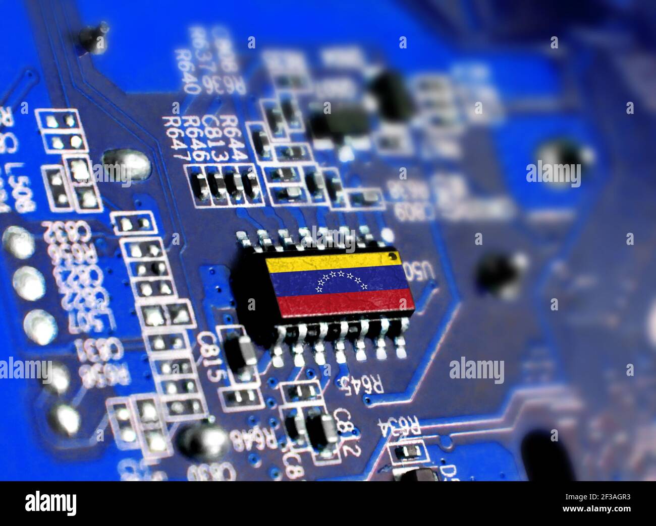 Electronic board with embedded microchip and shown flag of Venezuela ...