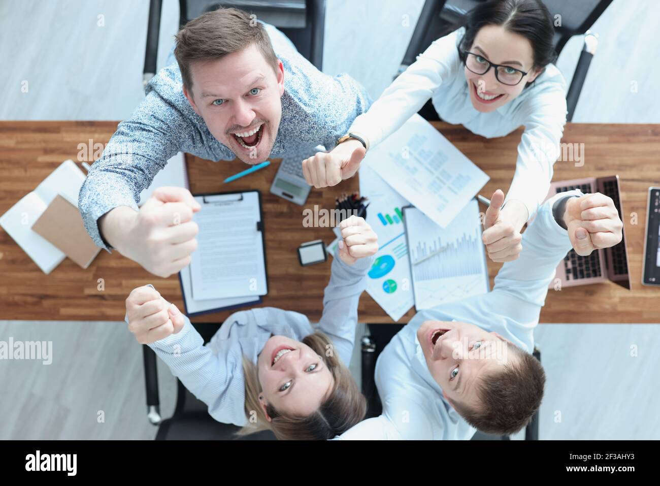 Businesspeople raising up hands hi-res stock photography and images - Alamy