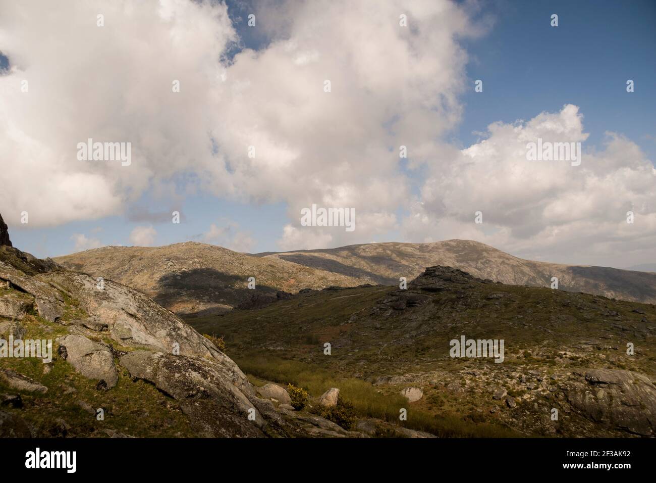 Mountain landscape of highland and meadows with contrast from shadows ...