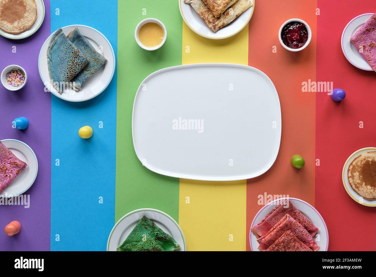 Rainbow pancakes, different color crepes. Spinach, beetroot powder ...