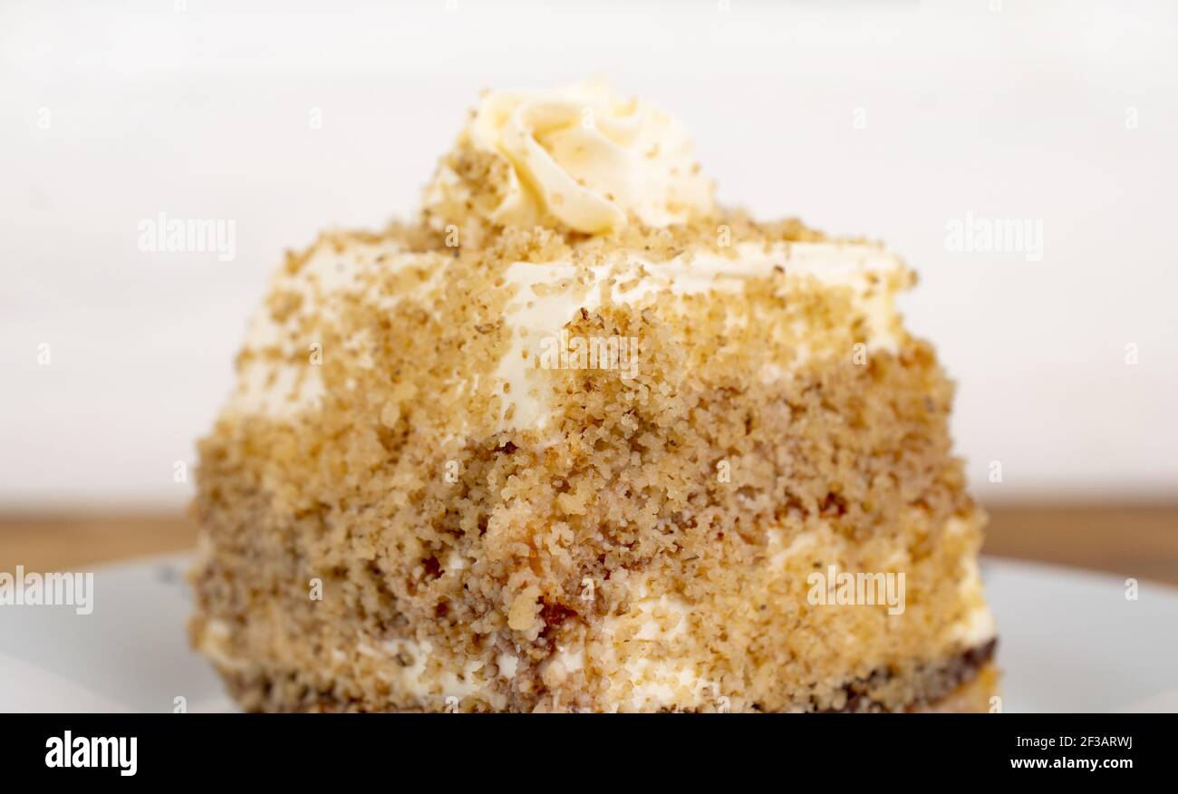 Delicious sponge cake topped with crushed walnuts Stock Photo - Alamy
