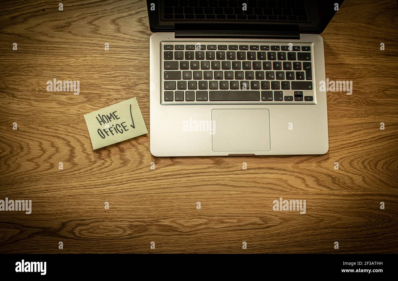 home office work note on wood table with laptop Stock Photo - Alamy