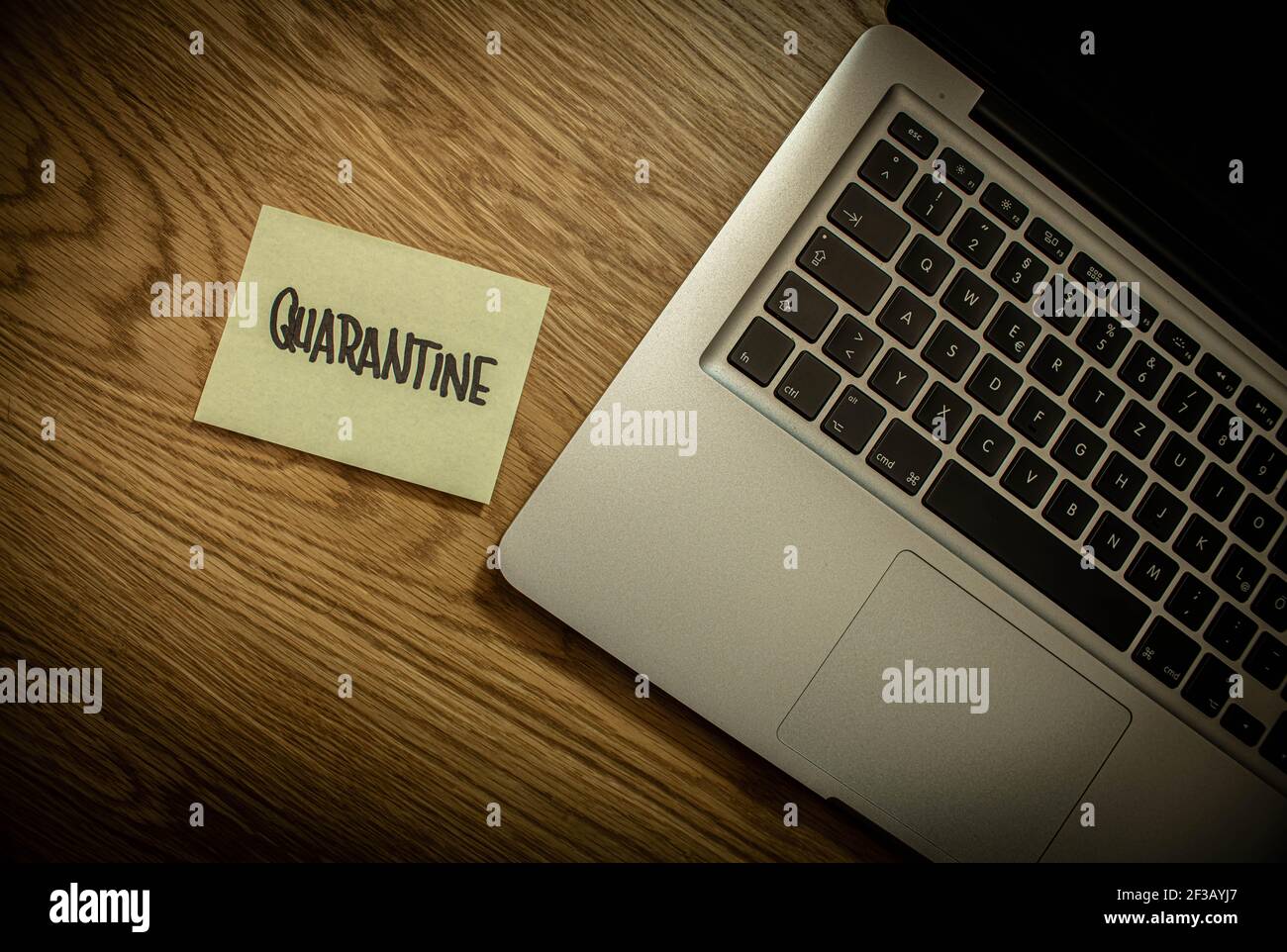 quarantine note in home office on wood table with computer Stock Photo ...