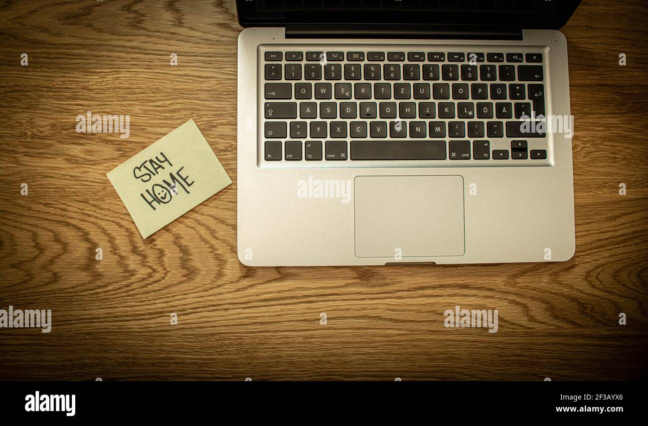 home office work note on wood table with laptop Stock Photo - Alamy