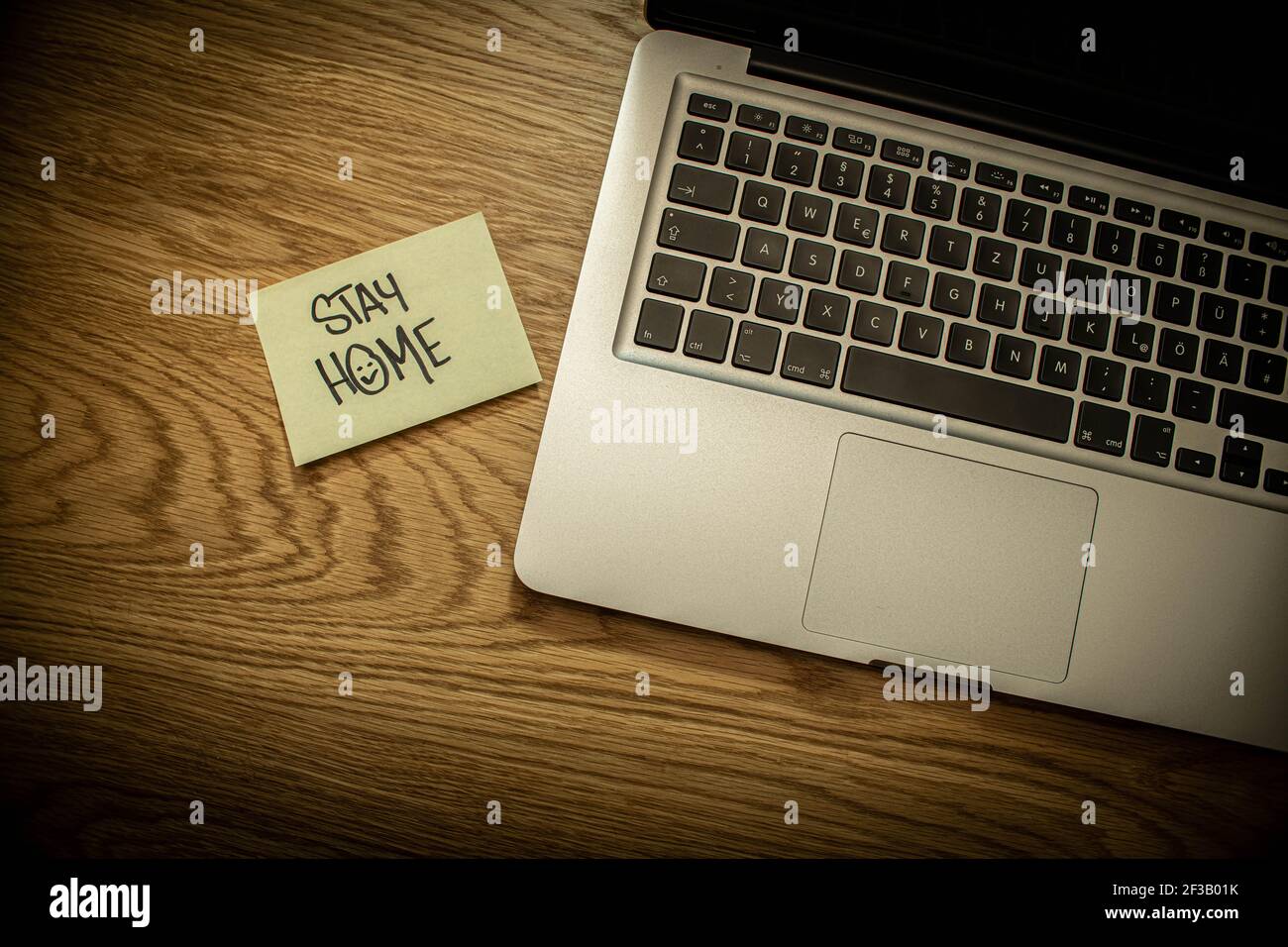 home office work note on wood table with laptop Stock Photo - Alamy