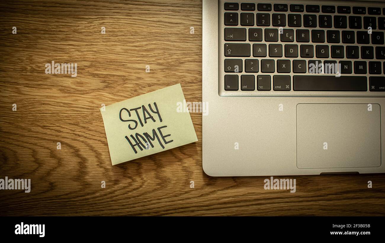 home office work note on wood table with laptop Stock Photo - Alamy