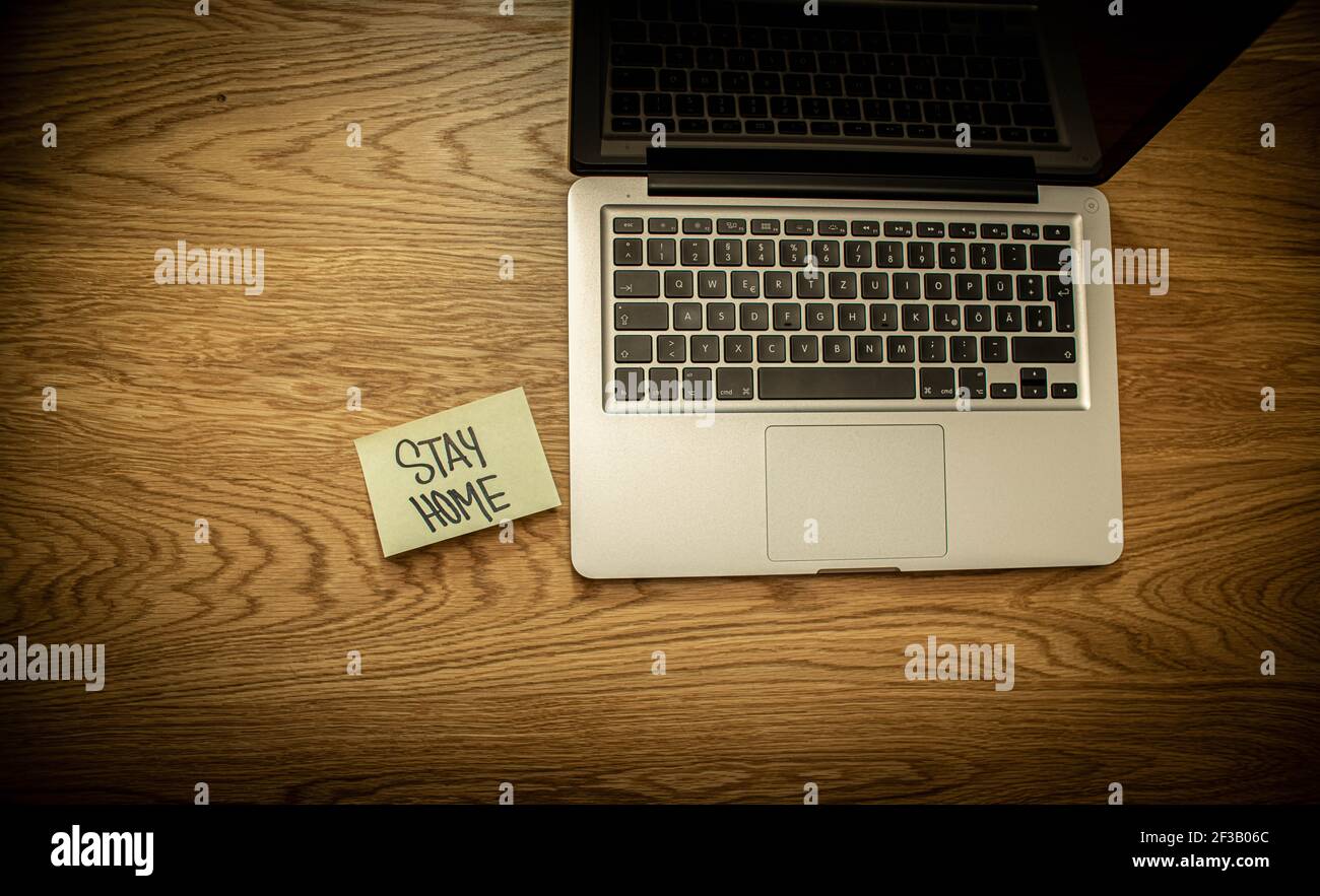 home office work note on wood table with laptop Stock Photo - Alamy